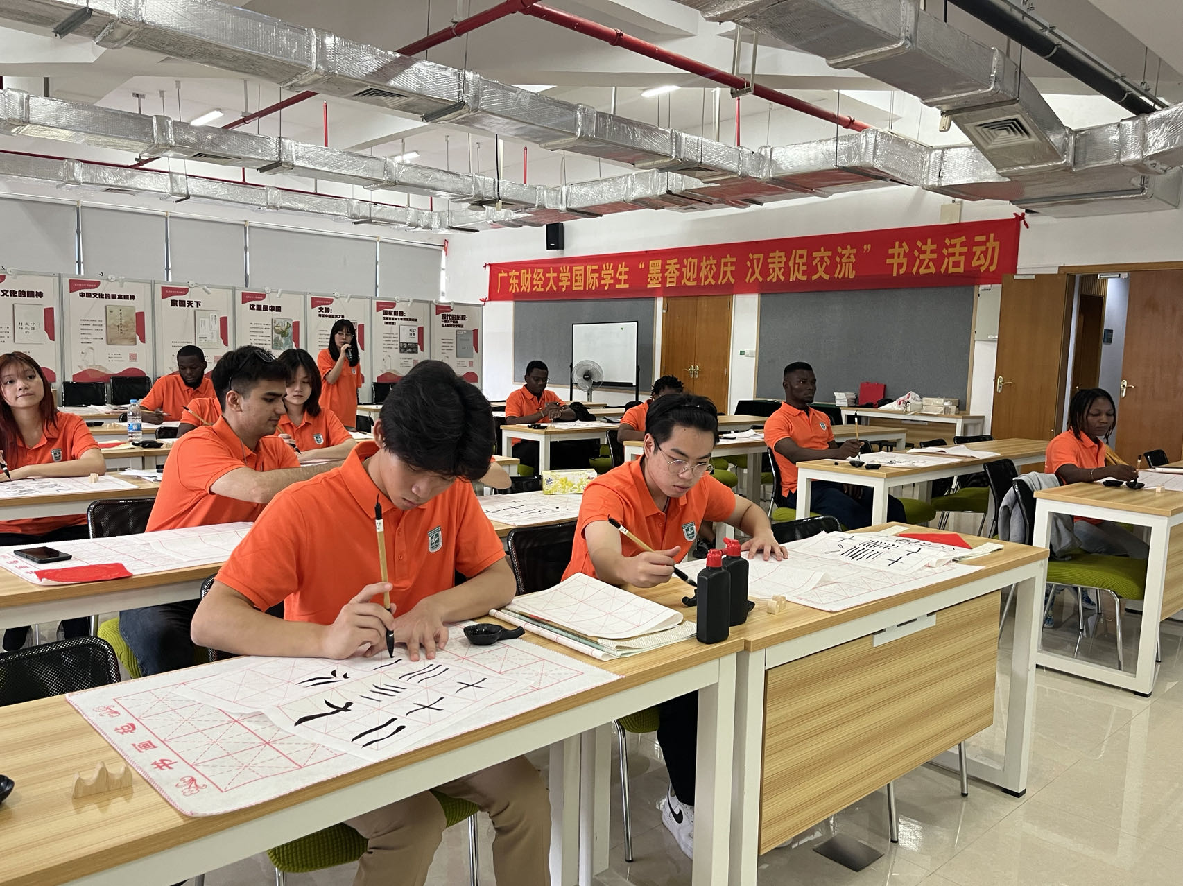 International Students Writing Caligraphy to Celebrate GDUFE 40th ...